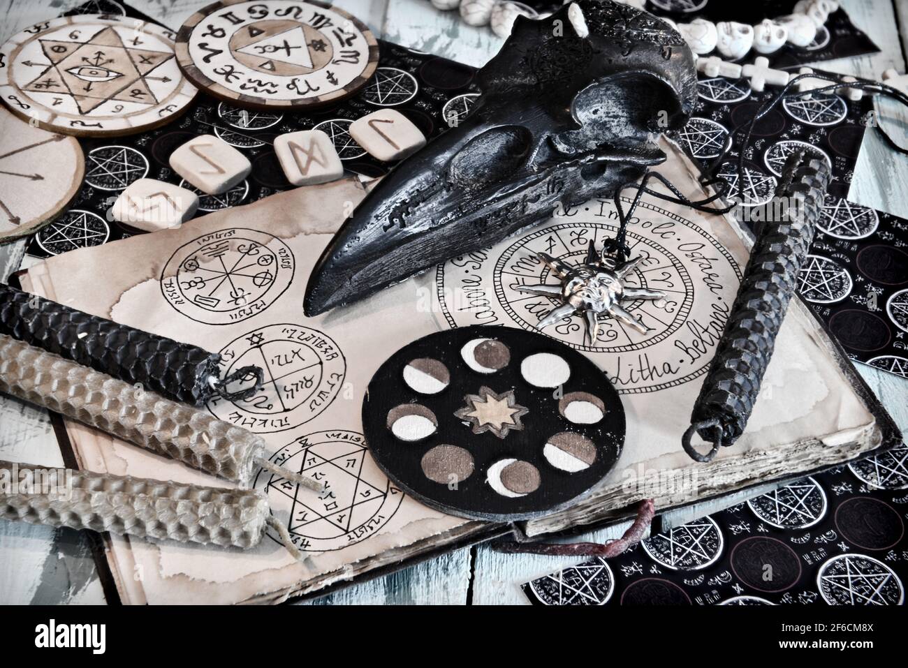 Grunge still life with witch diary with wiccan symbols on pages ...
