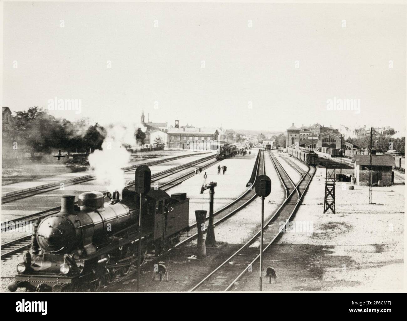 View on station sink and railroad with locomotive, carts and traveling ...
