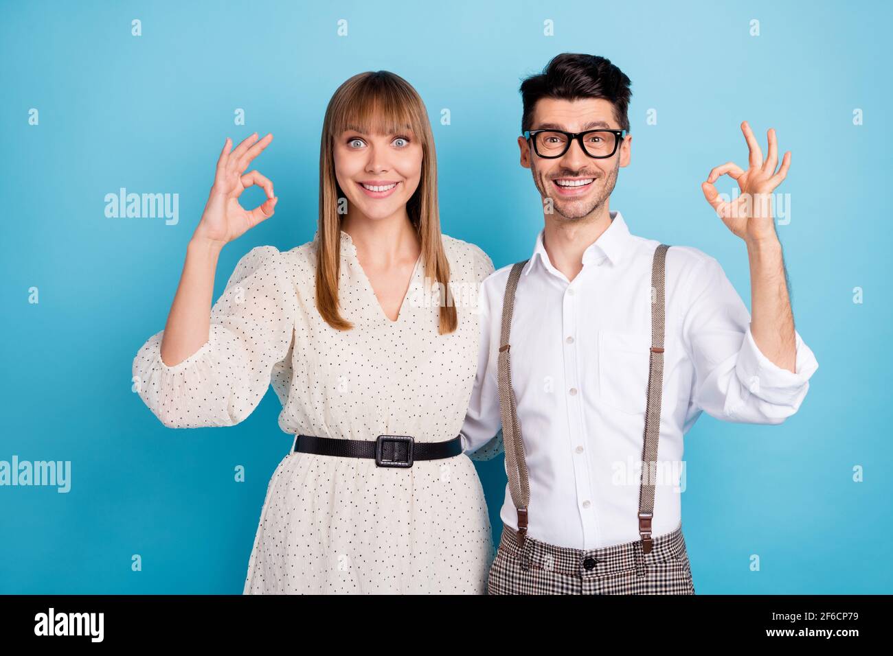 Photo of pretty cute young couple wear white outfit spectacles showing ...