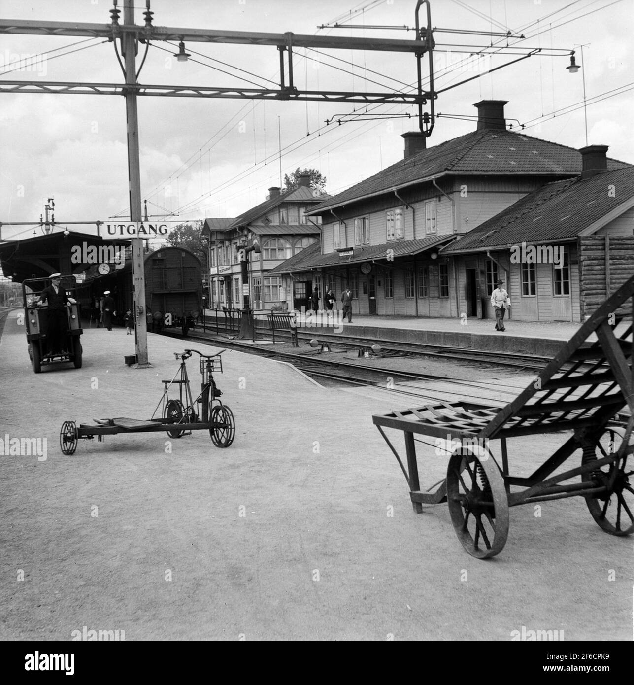 Wood station house. In the background railway restaurant, hotel and ...