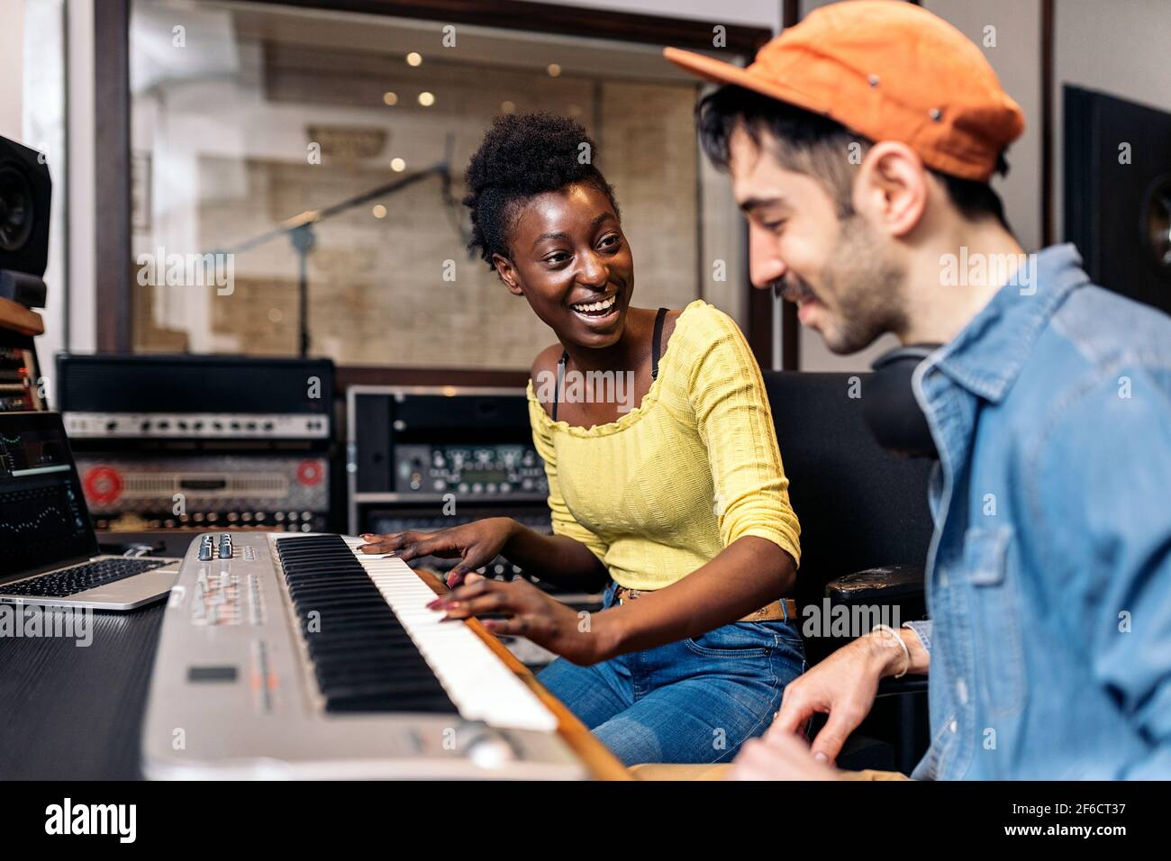 Stock photo of black woman playing electronic piano keyboard in music ...