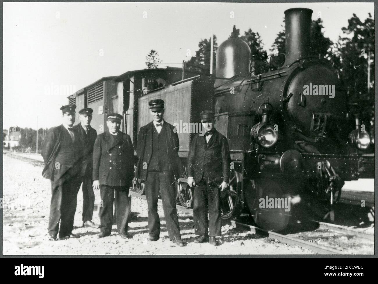 Steam Lok Ugj e 7 "Powerful" with staff at Strömberg Stock Photo - Alamy