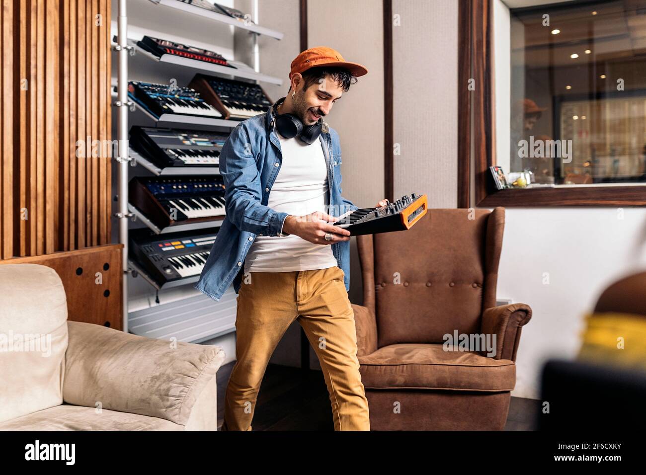 Stock photo of happy musician in professional music studio holding ...