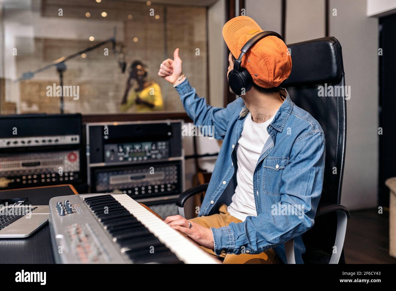 Stock photo of male music producer working with black singer in cool ...