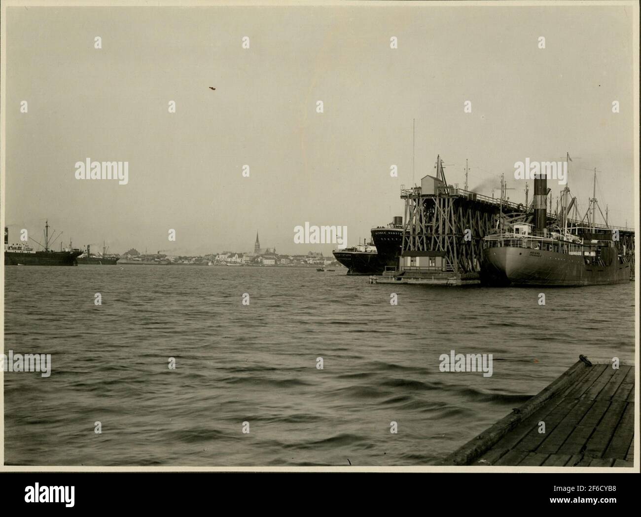 Loader at the ore loading bridge Stock Photo - Alamy