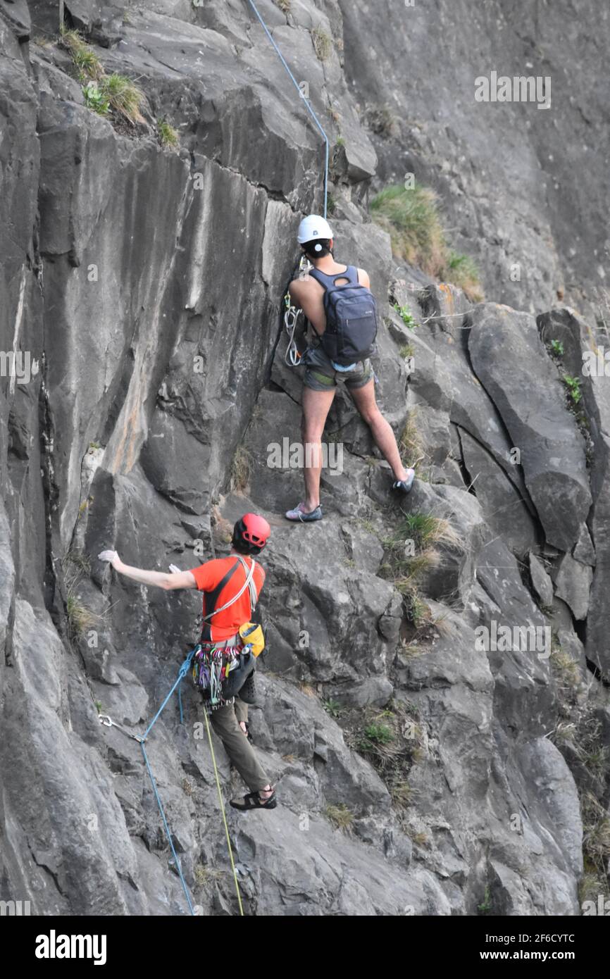 Two people rock climbing/abseiling - Avon Gorge Cliffs, Bristol, UK ...