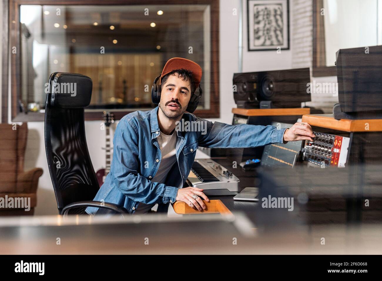 Stock photo of male music producer working with black singer in cool ...