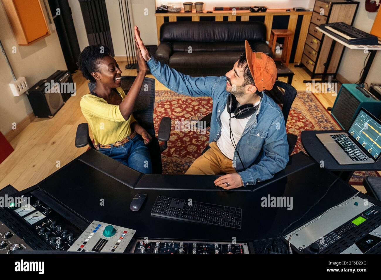 Stock photo of happy black singer working in professional music studio ...