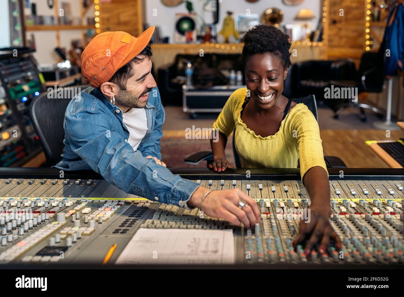 Stock photo of male music producer working with black singer in cool ...