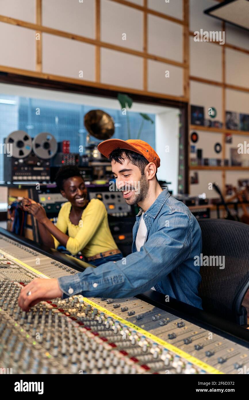 Stock photo of happy black singer working in professional music studio ...