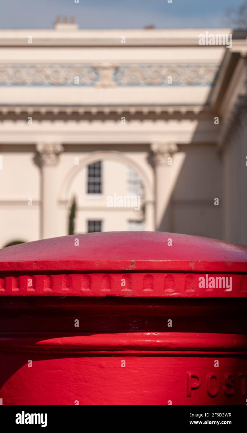 Iconic red UK post box Chester Terrace, part of the Grade 1 listed Nash ...