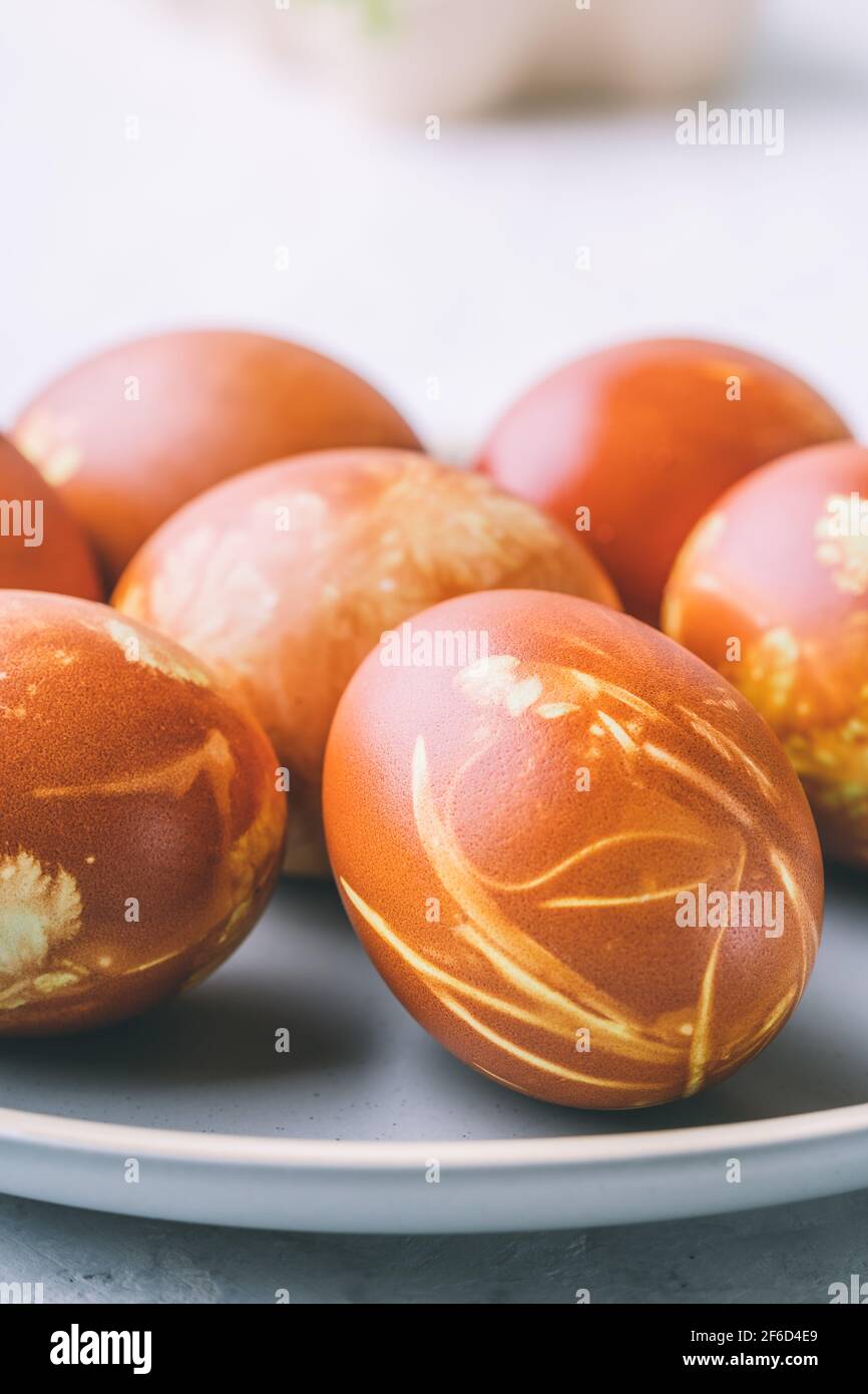 Easter brunch table. Natural dyed Easter eggs with onion shells and ...
