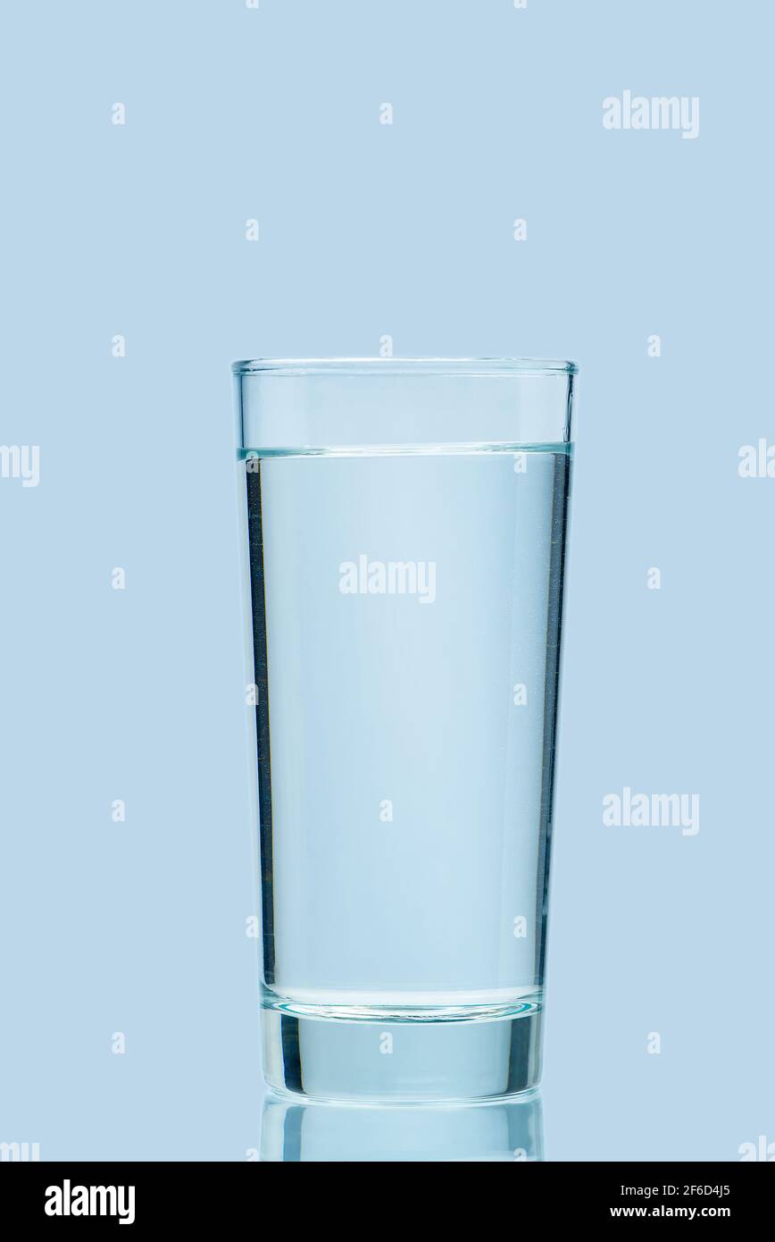 Pouring water. Pouring fresh clean drinking water to glass Stock Photo ...