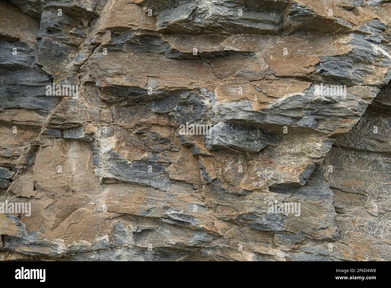 Geological layers of a rough structured stone in a full frame image ...