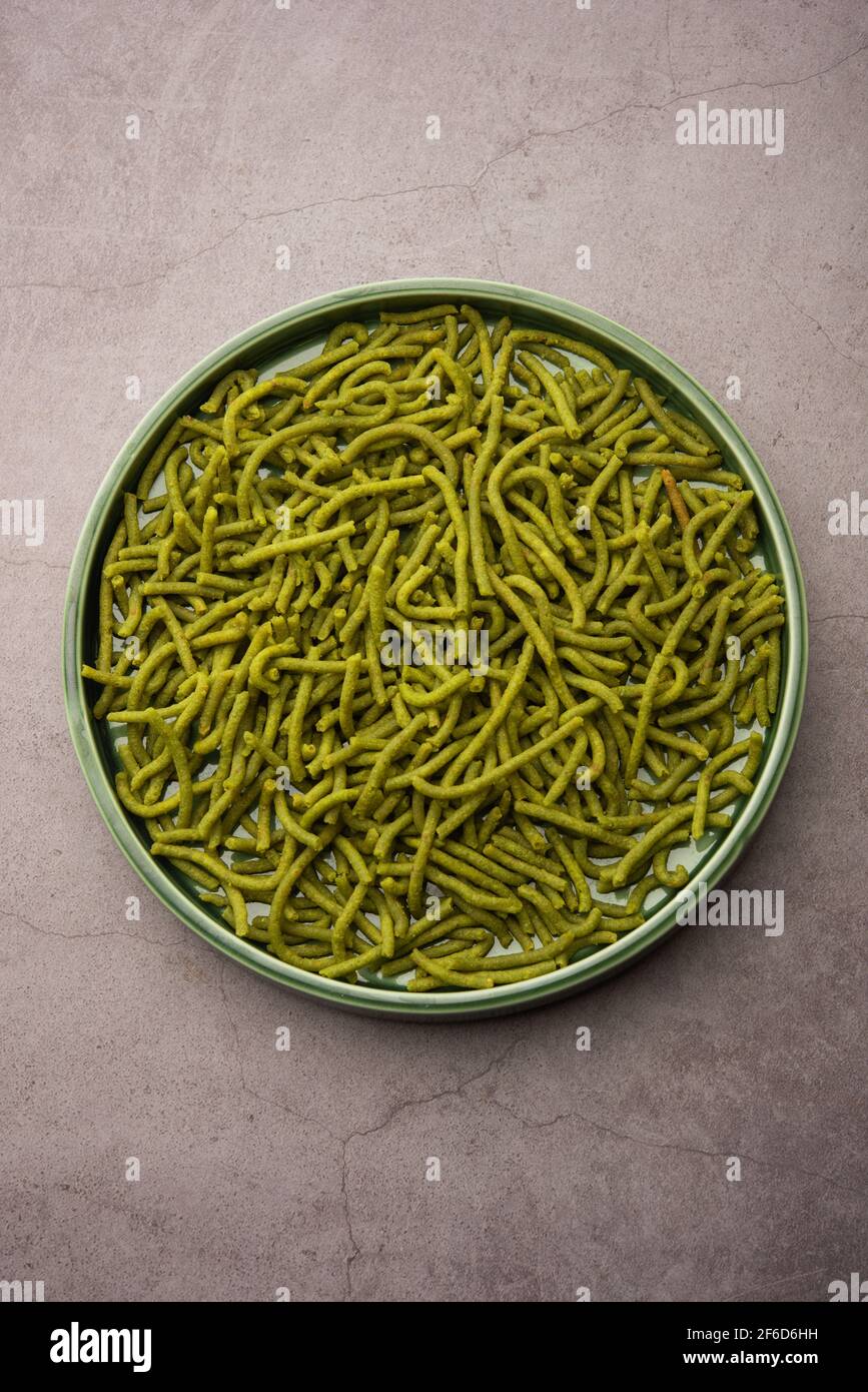 Spinach or palak sev are crunchy fried savory noodles. Homemade Thick ...