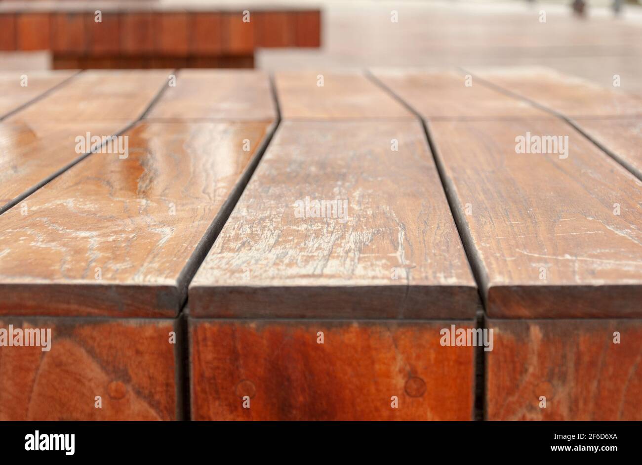 Surface of varnished wooden timbers. A park bench made of wood ...
