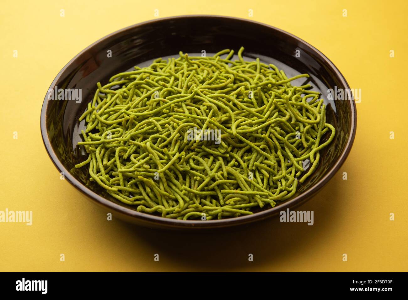 Spinach or palak sev are crunchy fried savory noodles. Homemade Thick ...