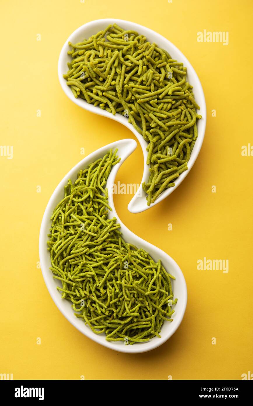 Spinach or palak sev are crunchy fried savory noodles. Homemade Thick ...