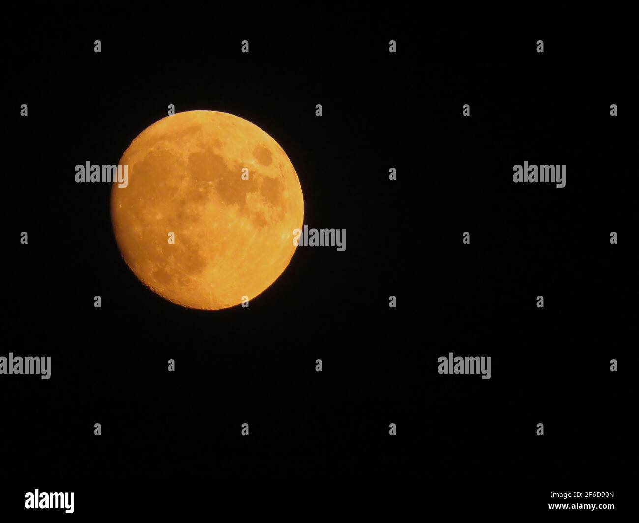 Full Yellow Moon in near plan Stock Photo - Alamy