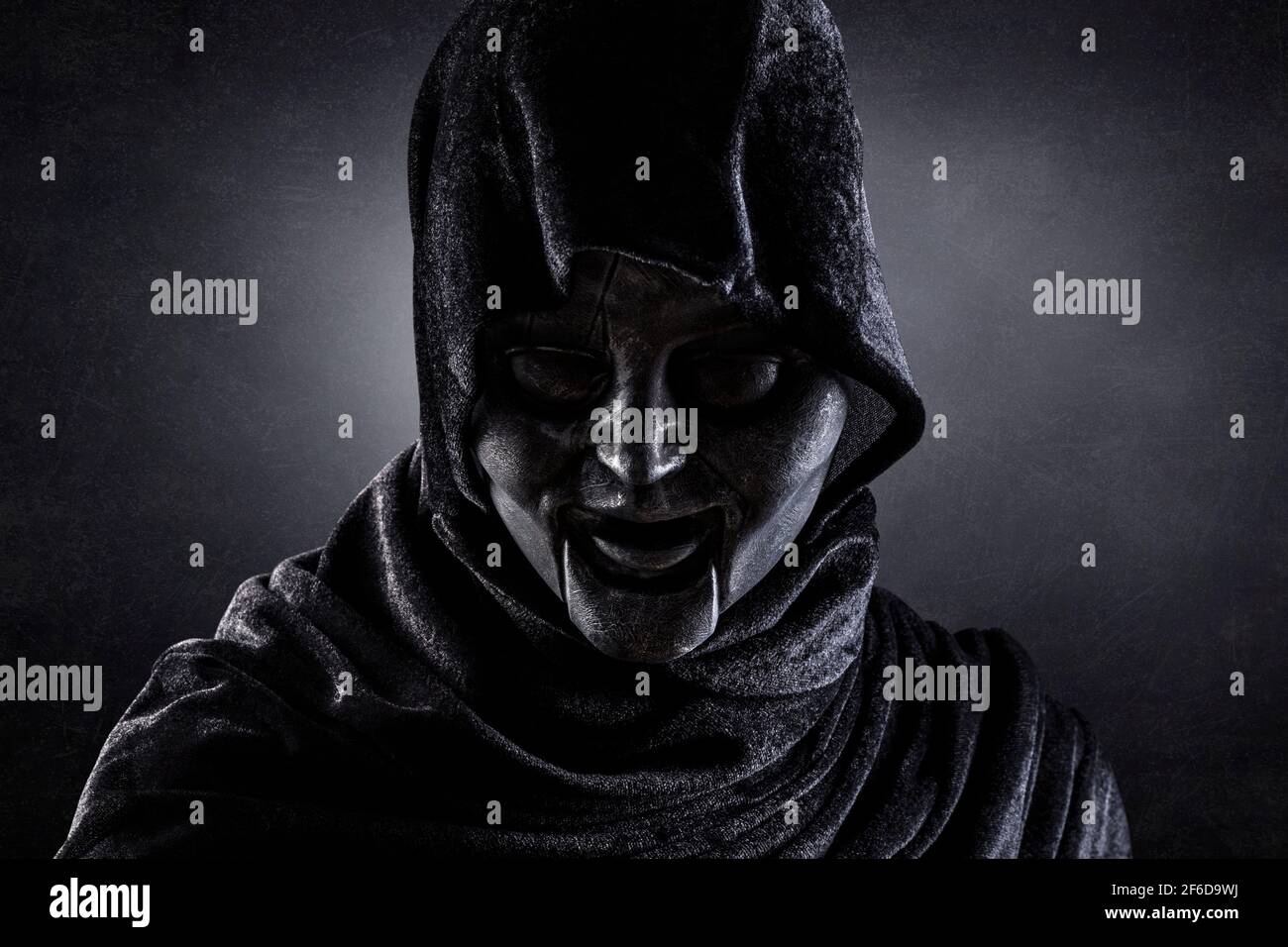 Portrait of a scary figure in hooded cloak Stock Photo - Alamy