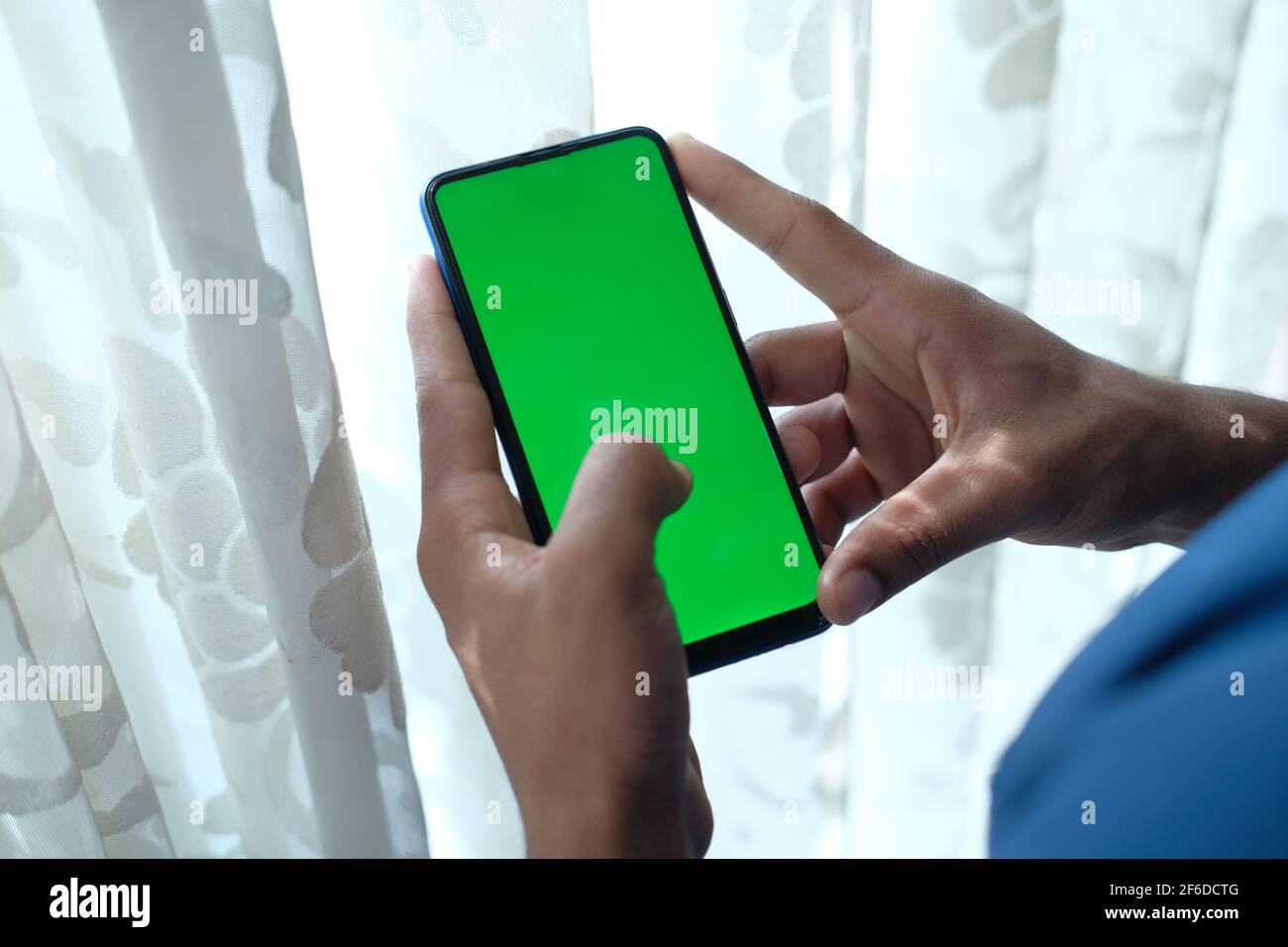 Rear view hand using smart hi-res stock photography and images - Alamy