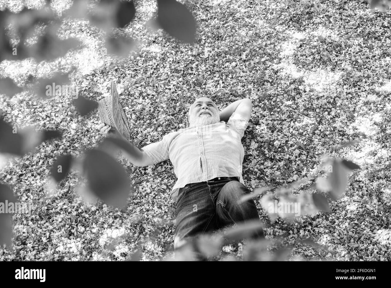 Positive emotions. Cheerful pensioner. Happy smiling grandpa looking up ...