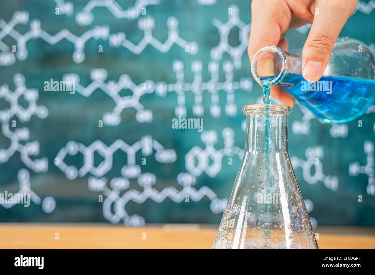 Laboratory glassware with blackboard background with various chemical ...