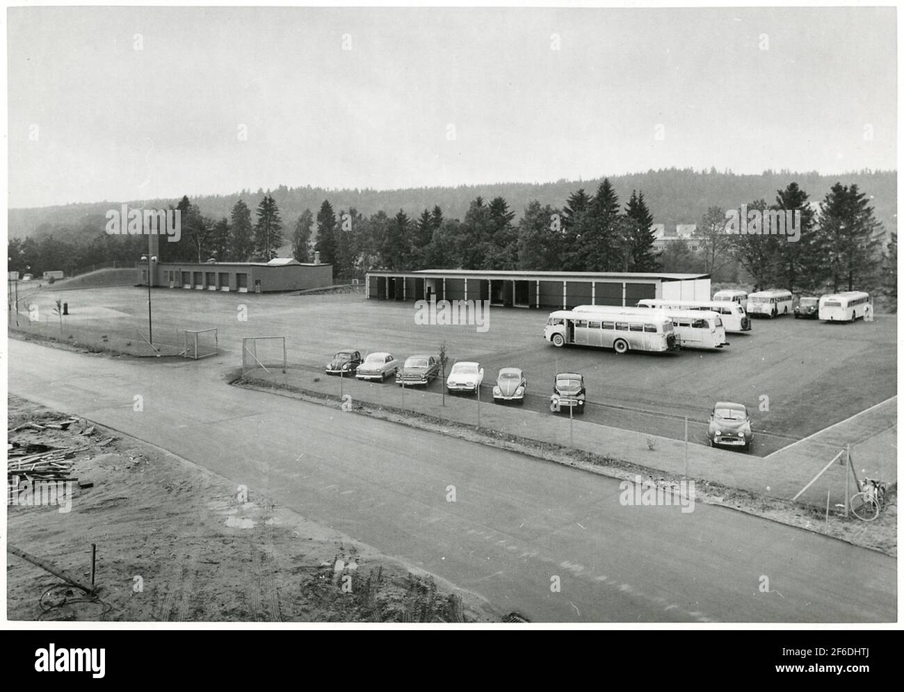 Buses and cars are parked at bus garages and workshop Stock Photo - Alamy