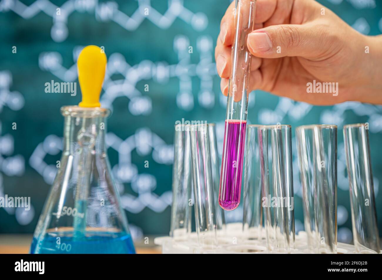 Laboratory glassware with blackboard background with various chemical ...