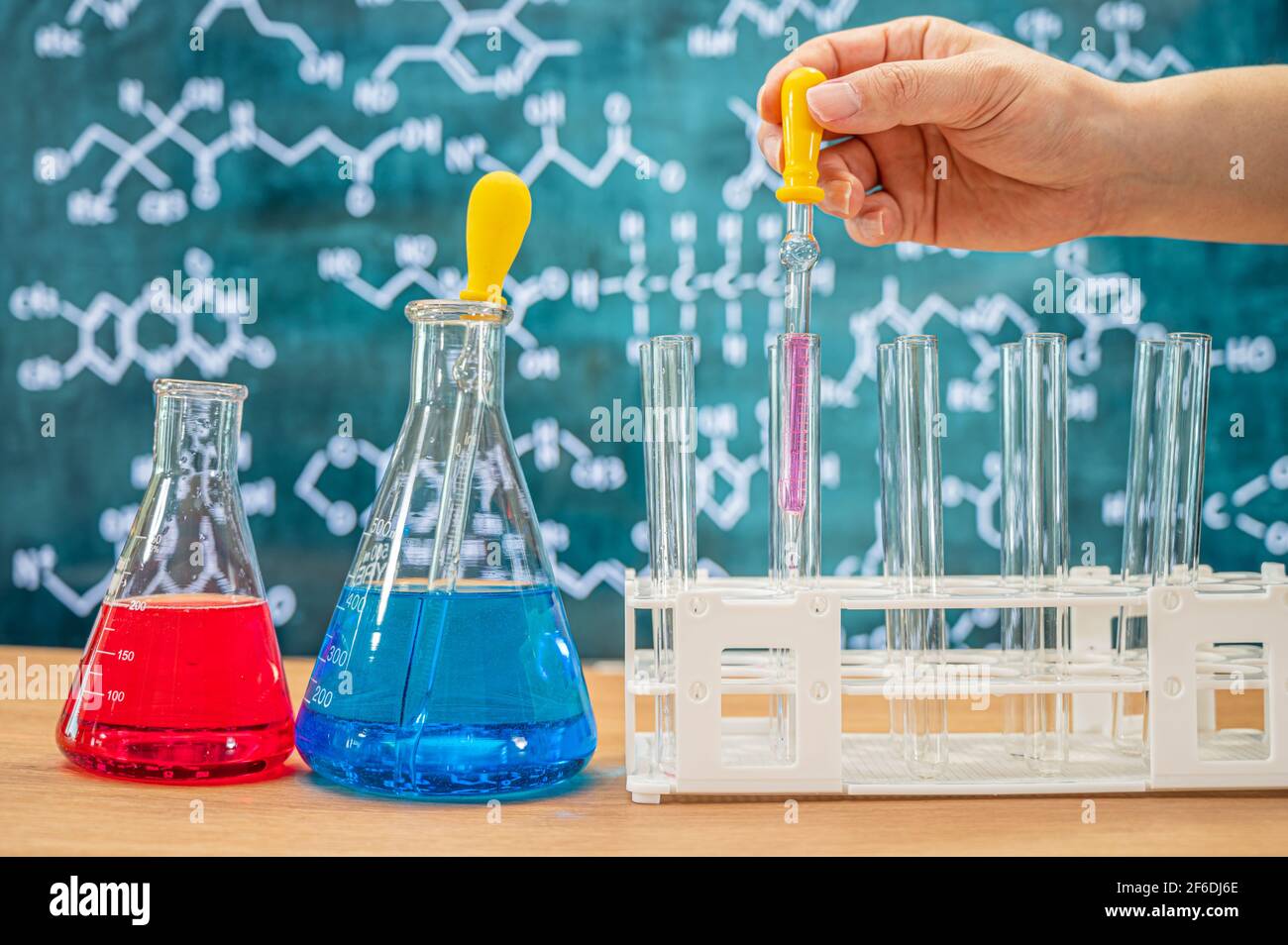 Laboratory glassware with blackboard background with various chemical ...