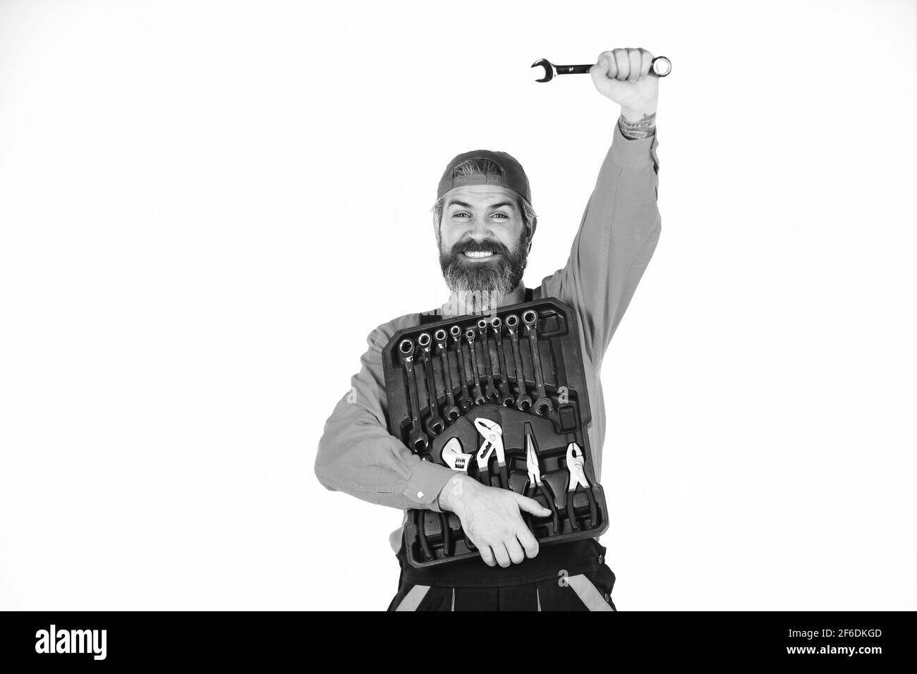 Man in uniform carries toolbox white background. Worker repairer ...
