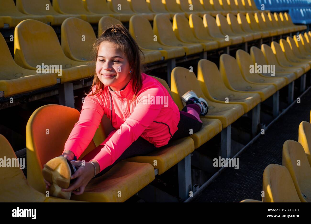 Athletic fit flexible girl child do splits leg stretch gymnastic ...