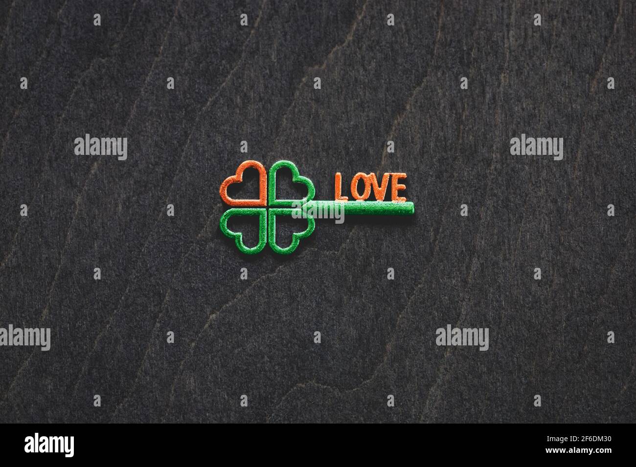Irish green shamrock shape key with orange heart, four-leaf clover good ...