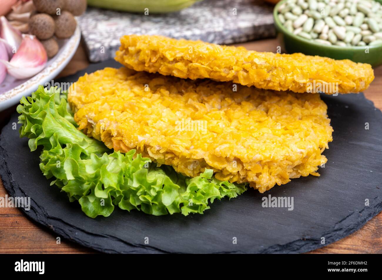 Vegetarian schnitzel made from grains, soybeans, mais, vegetables and ...