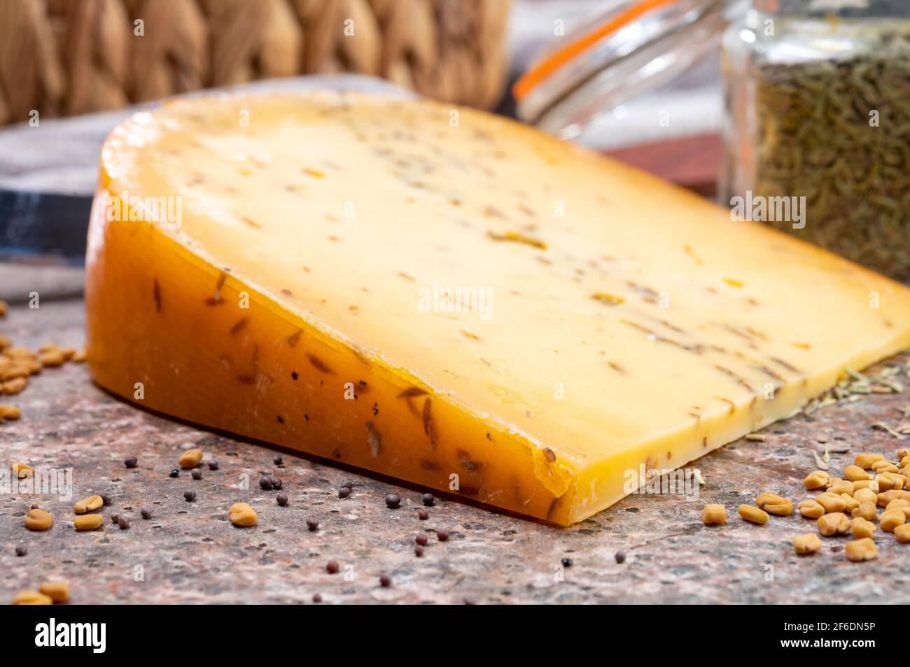 Cheese collection, piece of hard yellow Dutch gouda cheese with dried ...