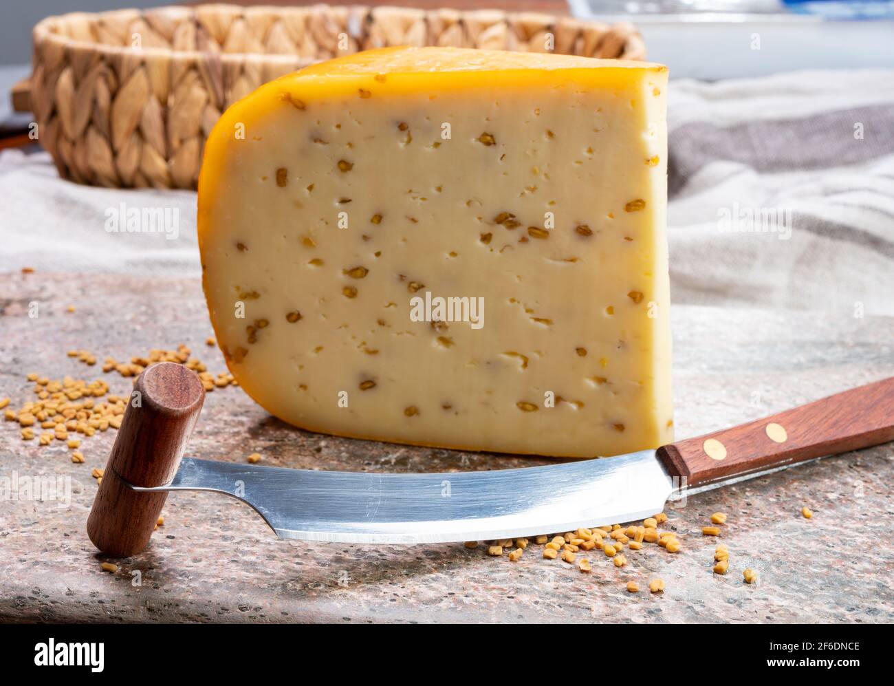 Cheese collection, piece of hard yellow Dutch gouda cheese with dried ...