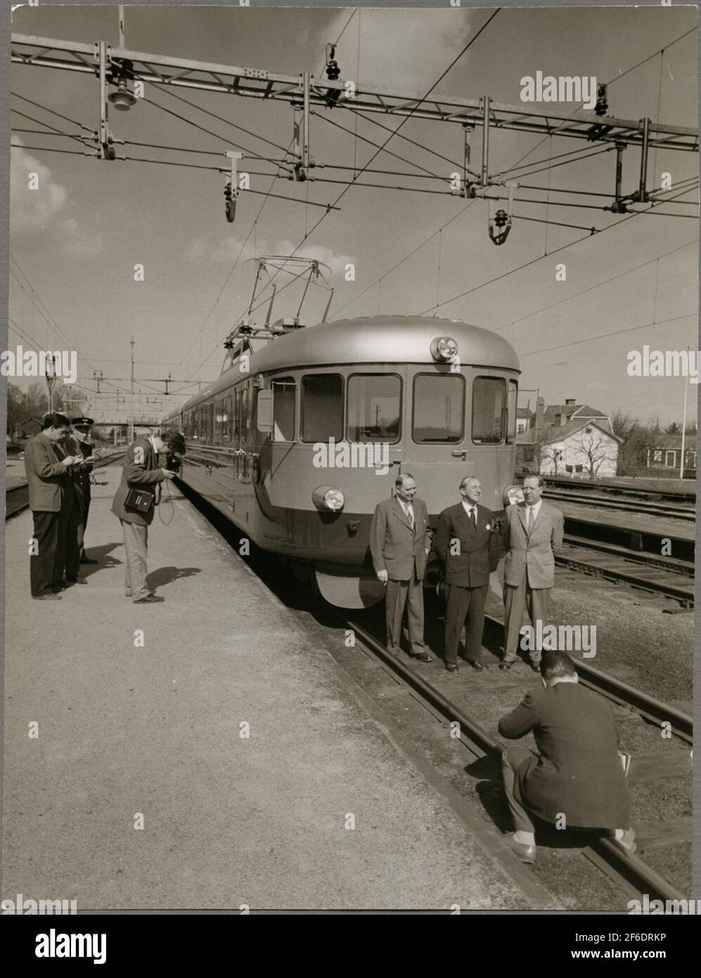 Group photo in front of rail bus at Perrong Stock Photo - Alamy