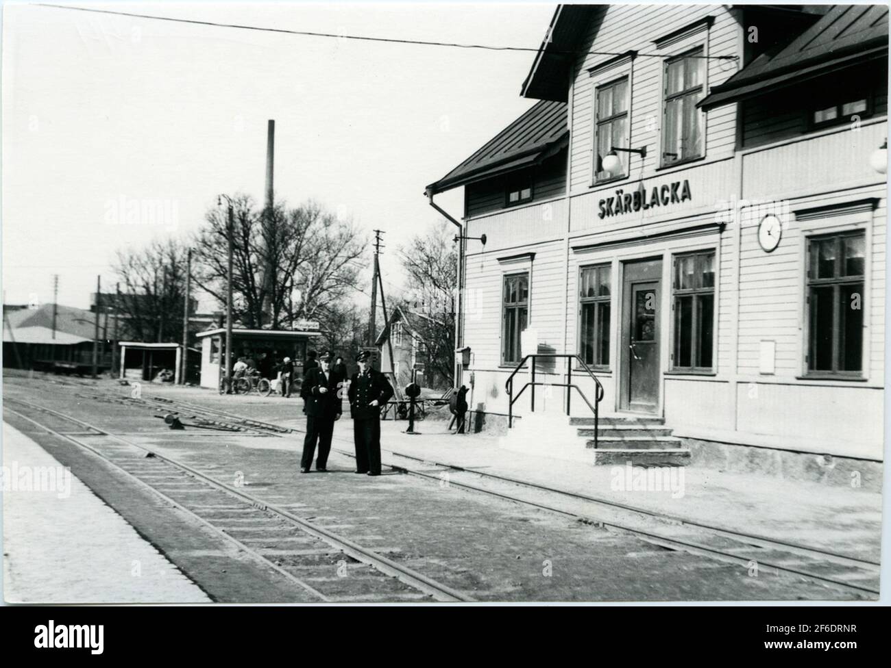 Staff outside the station house on the train page Stock Photo - Alamy