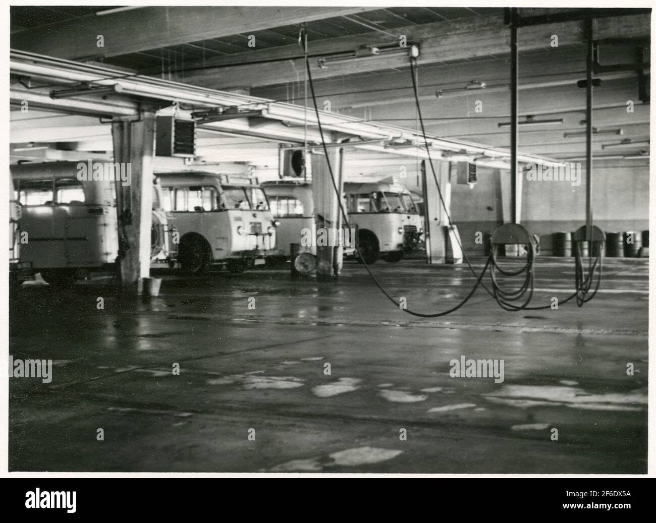 Buses in garage Stock Photo - Alamy