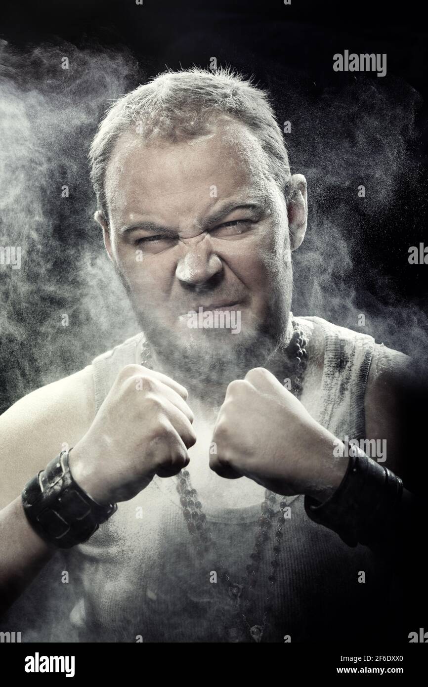 Portrait of the man in smoke and dust Stock Photo - Alamy
