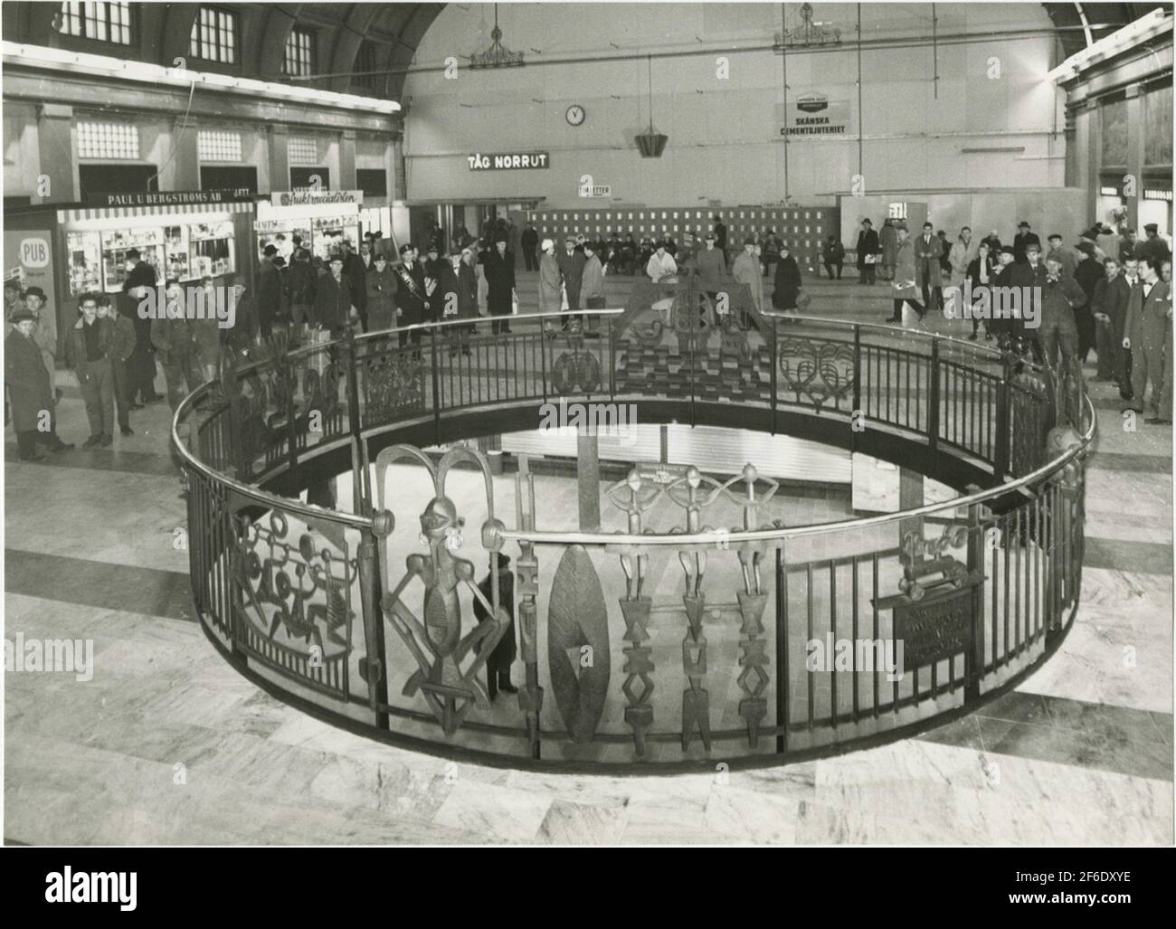 Around cast iron railings in the waiting floor at Stockholm Central ...