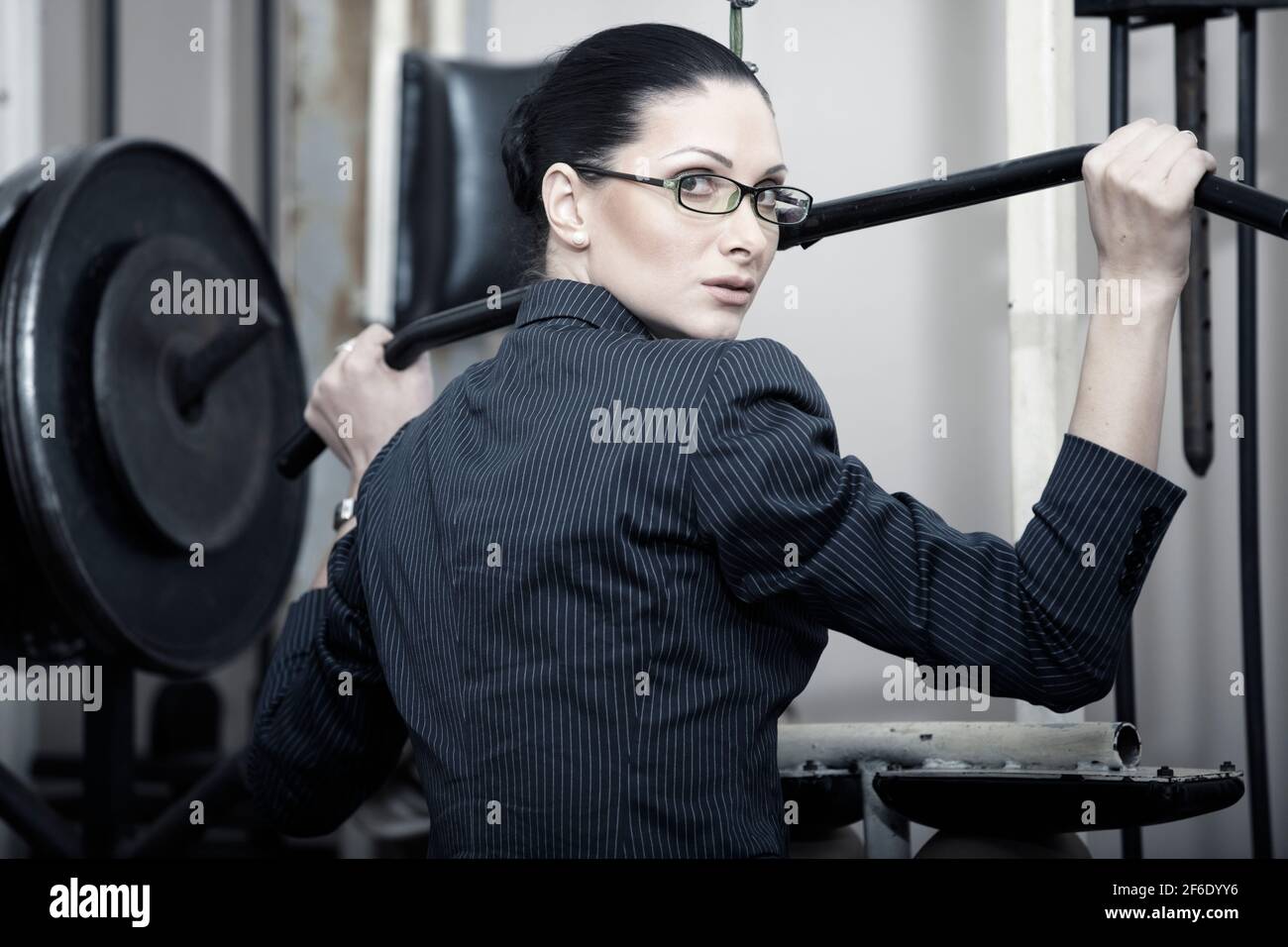 Modern businesswoman in gym doing exercise Stock Photo - Alamy