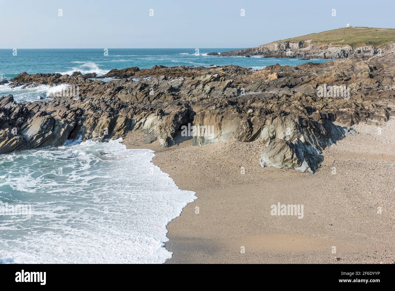 A wave creeping ashore at the secluded Little Fistral; in Newquay in ...