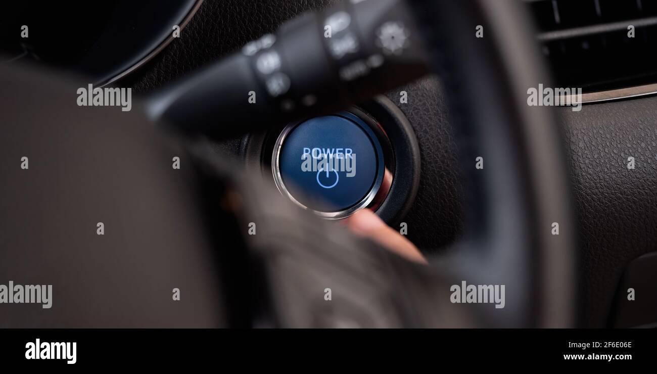 Woman pushing engine start hi-res stock photography and images - Alamy