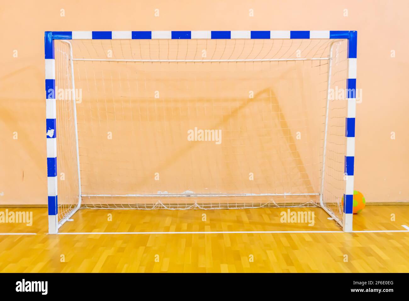 Football goal at a sports center, a sports hall with a wooden floor and ...
