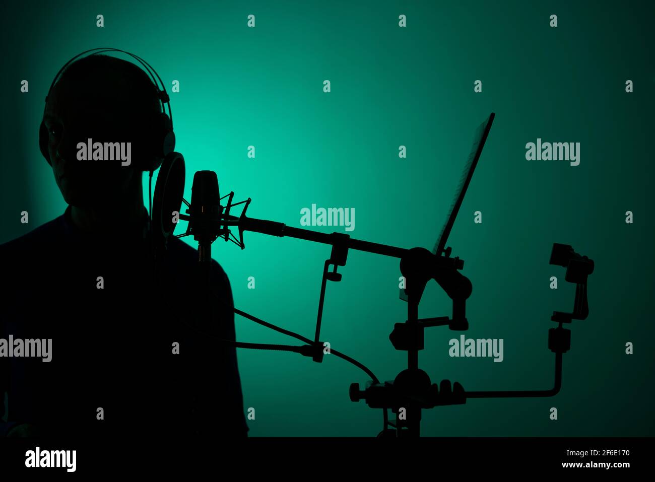 Voiceover artist actor recording voice overs in professional audio ...