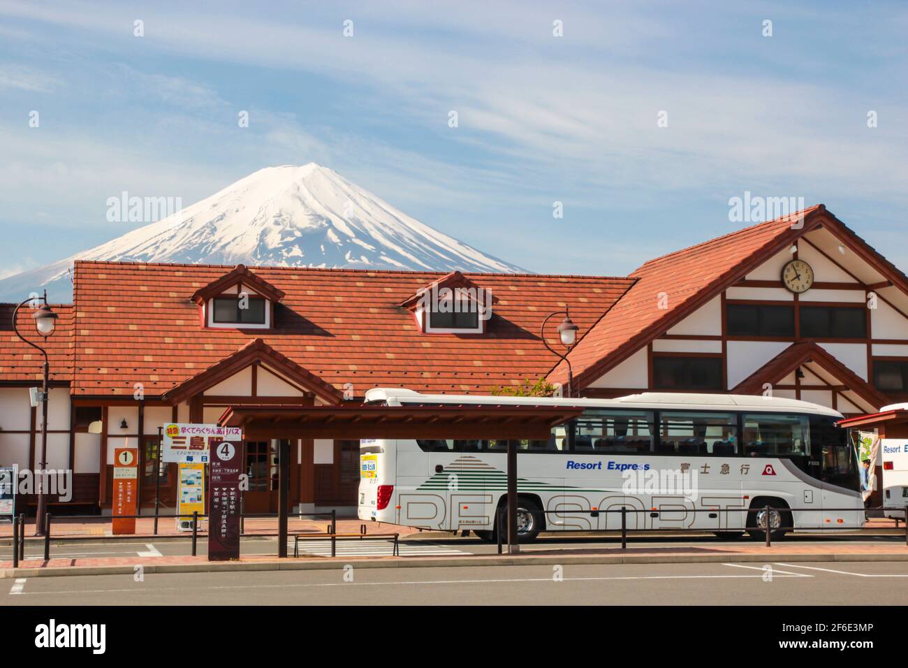 Snow capped Mount Fuji in the background of the bus station for the ...
