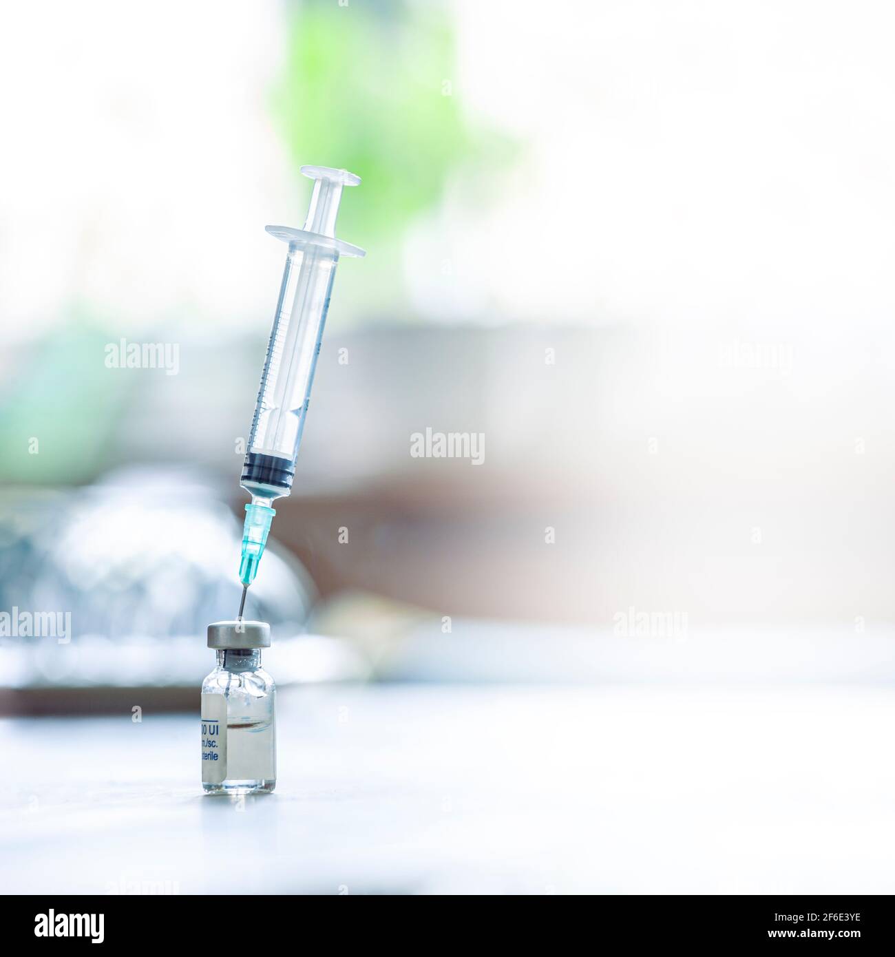 A syringe with the needle in the vaccine vial Stock Photo - Alamy