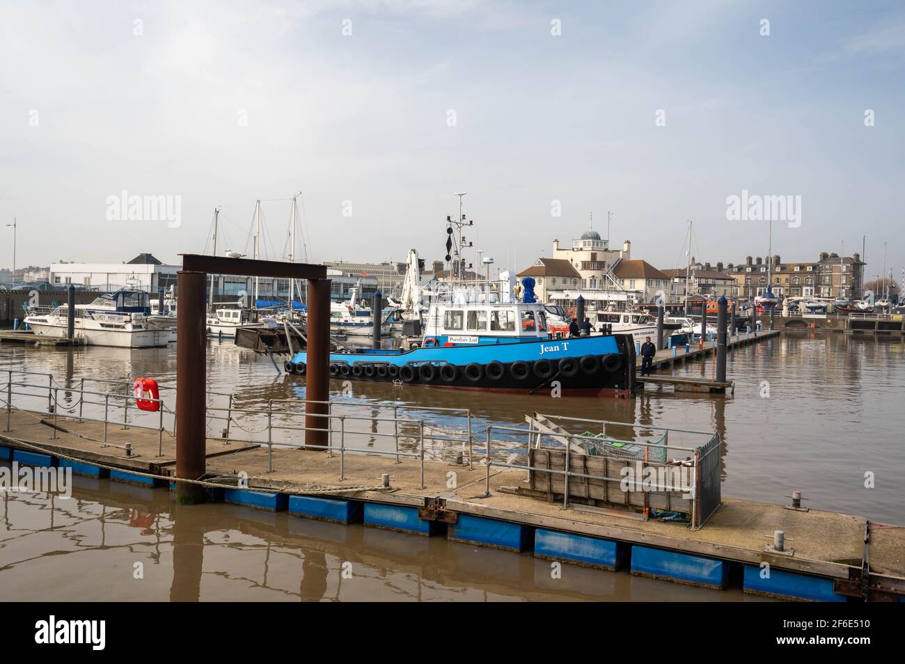 Lowestoft marine harbour with a ship going out to sea Stock Photo - Alamy