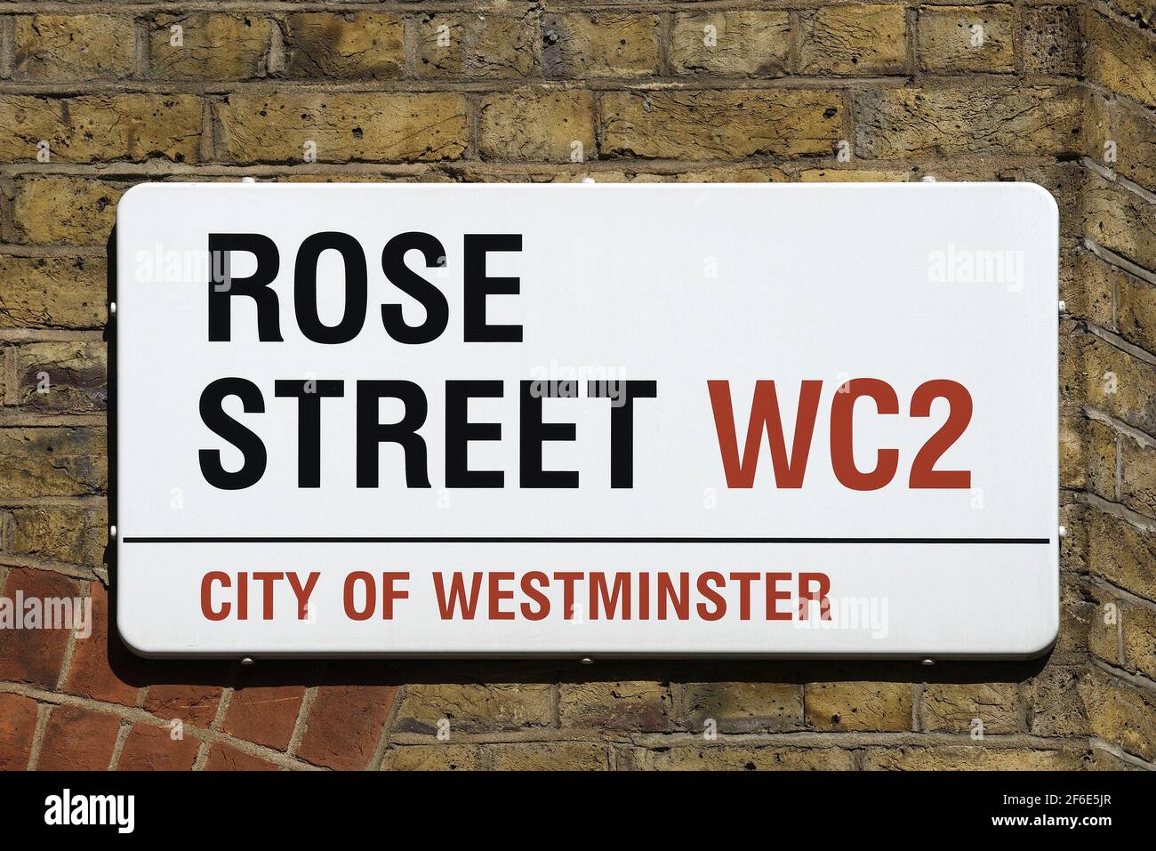 London, England, UK. Street sign: Rose Street, WC2, City of Westminster ...